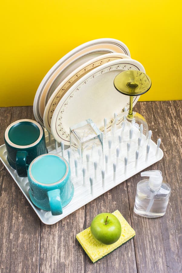 Dish Dryer with Clean Dry Dishes and Detergent with Washcloth on the ...