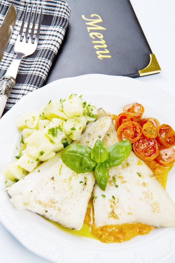 Dish of Fresh Black Cod with Potatoes and Tomatoes Sauce Stock Image ...