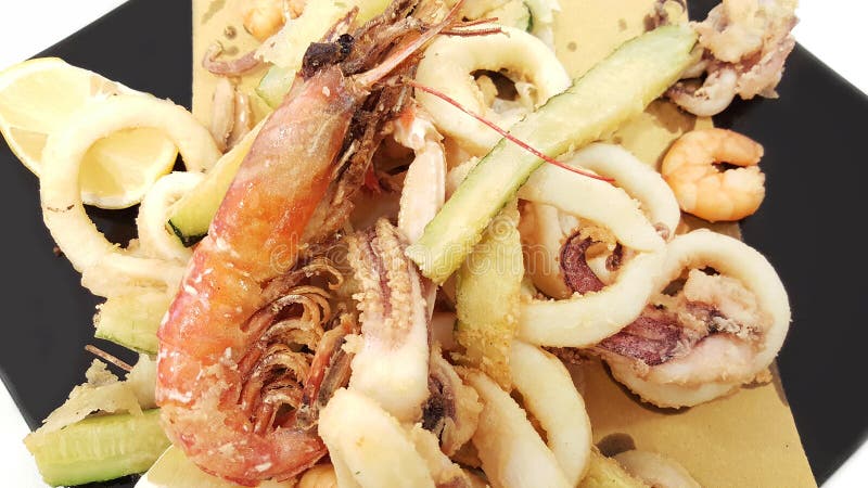 Fried mixed fish on dish stock photo. Image of shellfish - 99106086