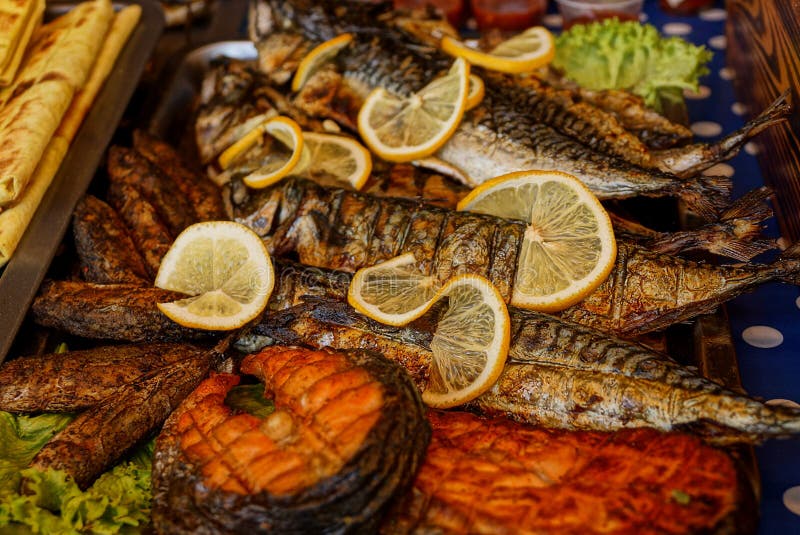 Fried Pieces of Fish with Lemon Slices on the Table Stock Photo - Image ...