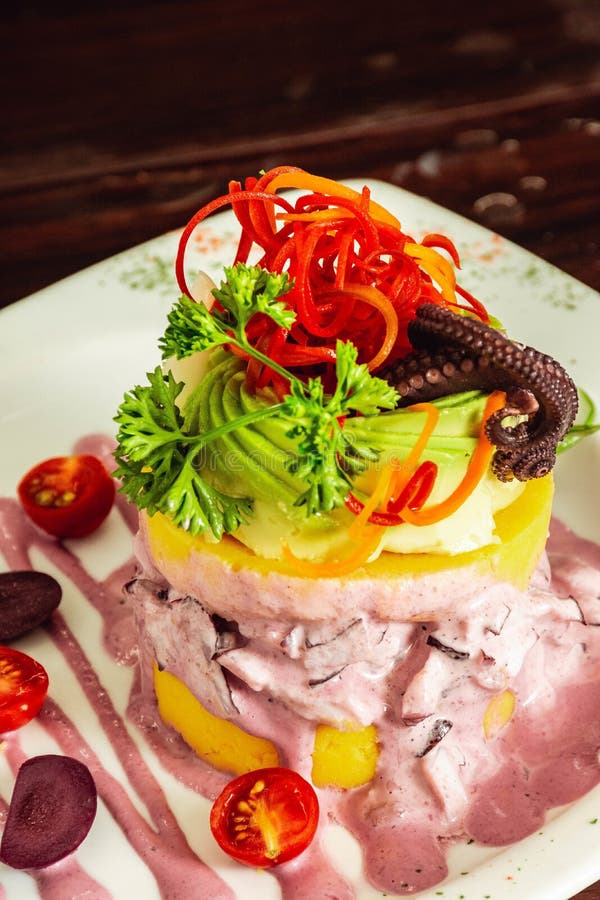 Dish with Potatoes, Octopus Tentacles, Avocados, and Vegetables Stock ...