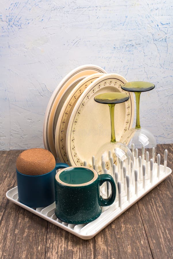 Dish Rack with Clean Dry Dishes on Kitchen Counter Stock Image - Image ...