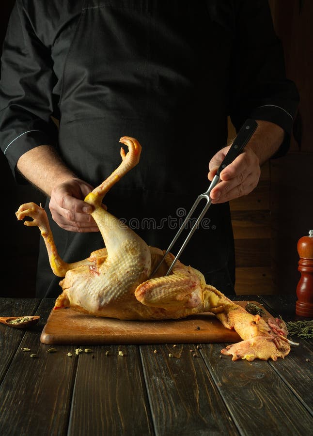 A Dish of Raw Chicken by the Hands of a Chef in a Restaurant Kitchen ...
