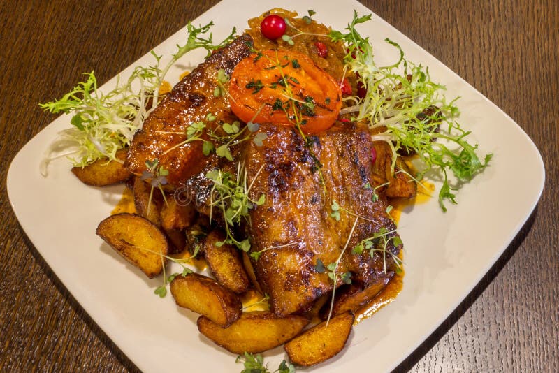 Dish with Ribs and Vegetables on Table Stock Photo - Image of tasty ...