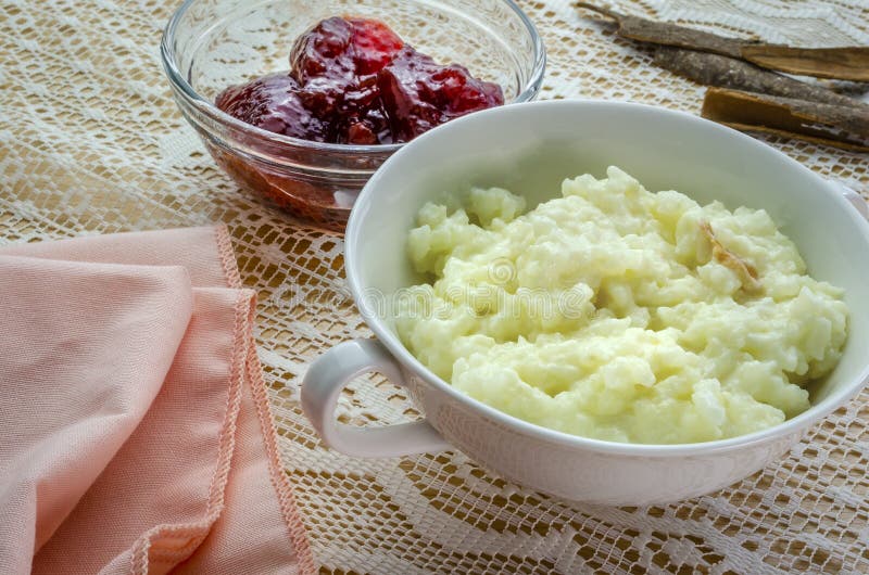 A Dish of Rice Pudding with Jam and Cinnamon Bark. Stock Photo - Image ...