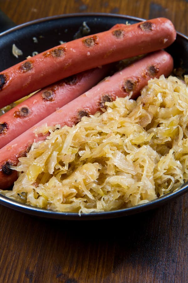 Dish with Roasted Wurstel and Sauerkraft Stock Photo - Image of ...