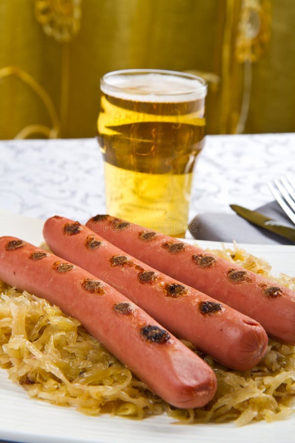 Dish with Roasted Wurstel and Sauerkraft Stock Photo - Image of ...