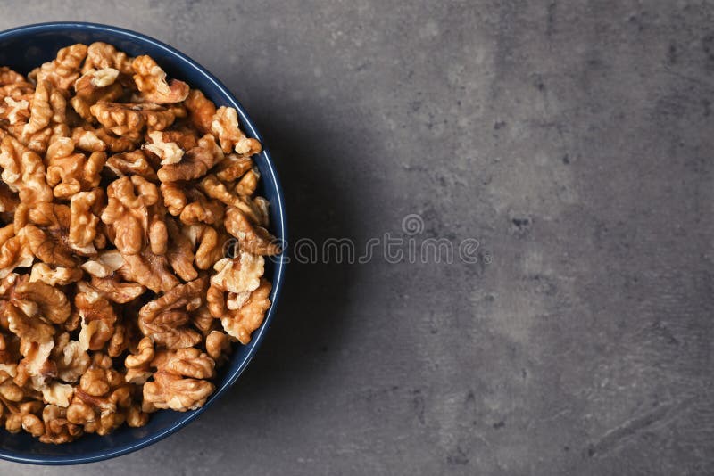 Dish with Walnuts on Grey Background, Top View. Stock Photo - Image of ...