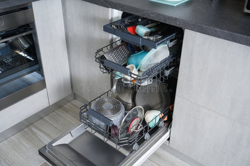 Dishwasher Machine, Open and Loaded with Dishes in the Kitchen, after ...