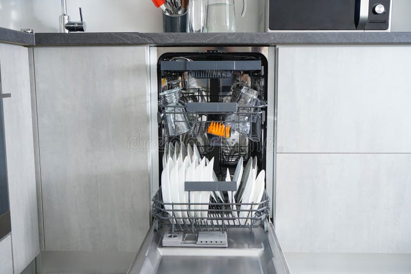 Dishwasher Machine, Open and Loaded with Dishes in the Kitchen, after ...