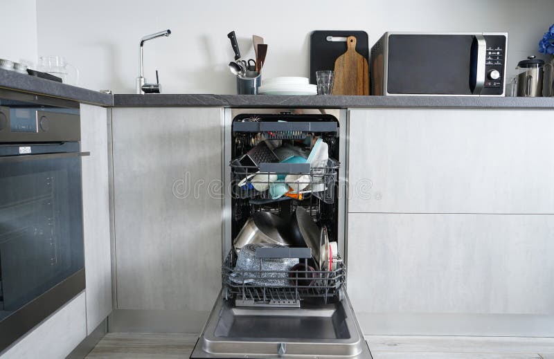 Dishwasher Machine, Open and Loaded with Dishes in the Kitchen, after ...