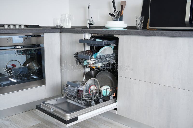 Dishwasher Machine, Open and Loaded with Dishes in the Kitchen, after ...