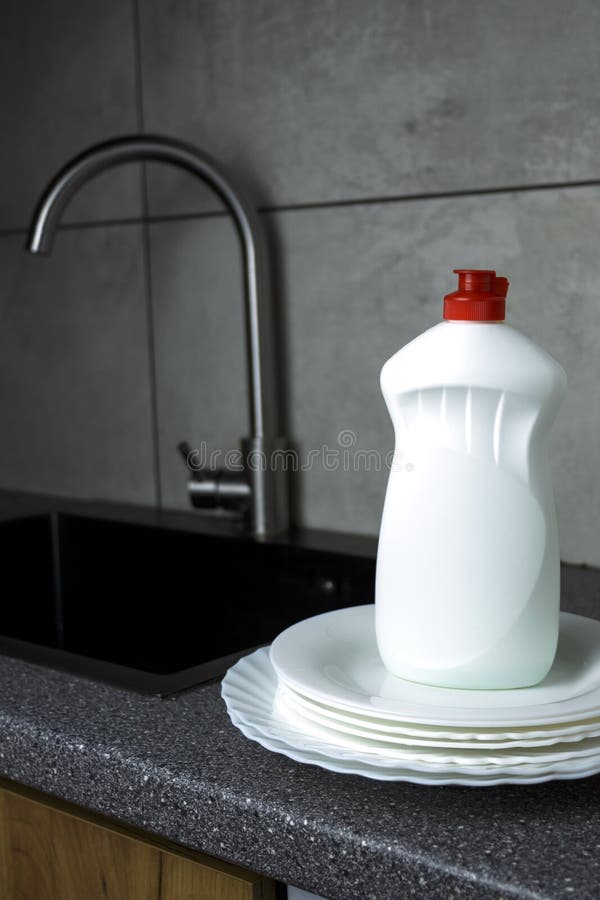 Dishwashing Detergent and Different Clean Plates on the Table on ...