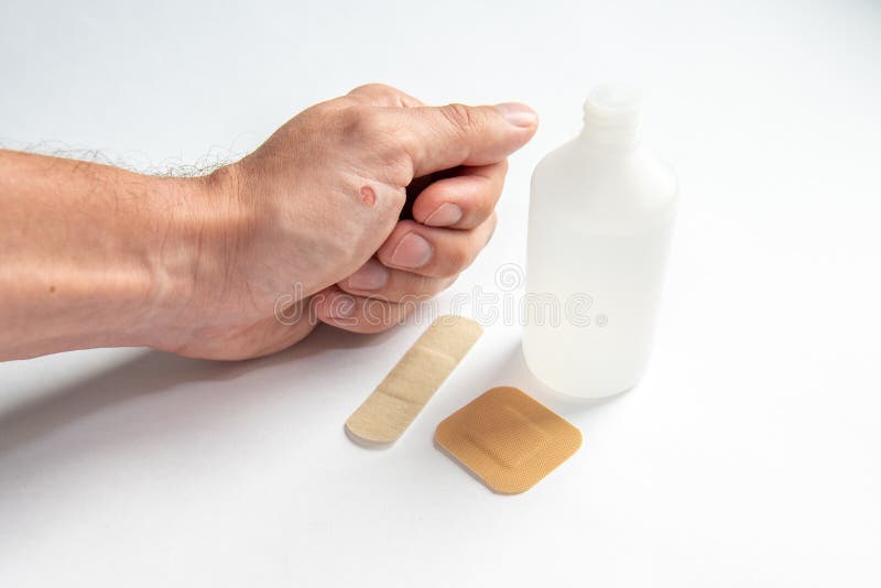 Disinfecting the Wound on the Hand and Applying a Patch Stock Photo ...