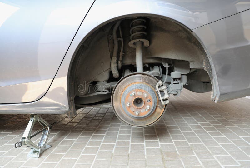 Disk Brake and Caliper in New Tire Replacement Process Stock Photo ...