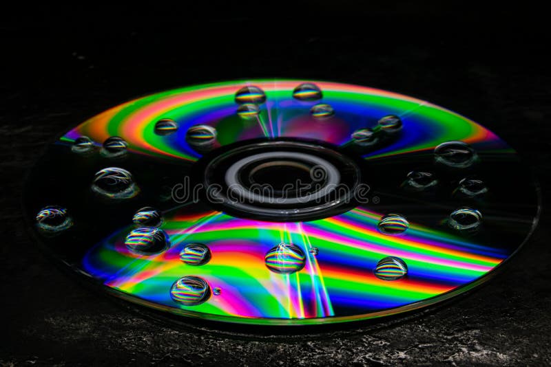 Disk, drops and light stock image. Image of rainbow - 228487375