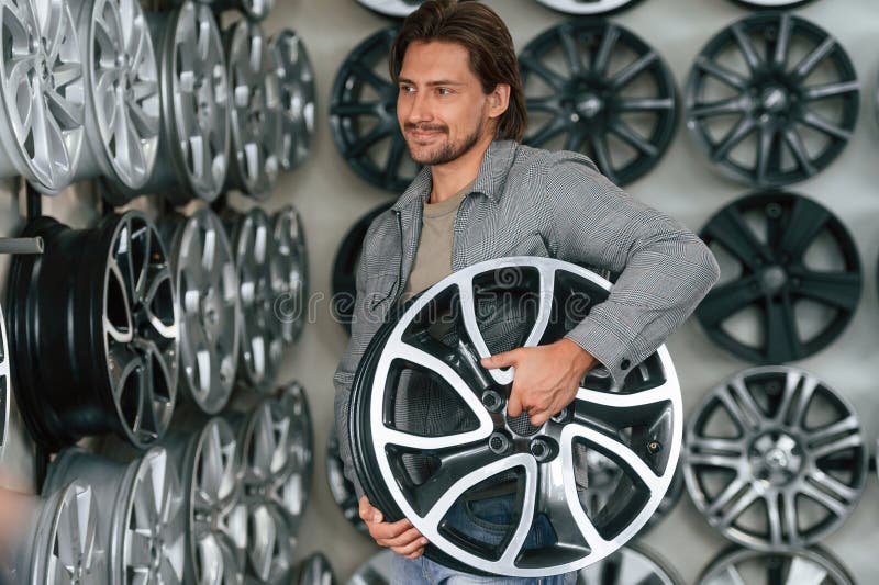 Disk in Hands. Man is in the Tire Fitting Car Service Stock ...