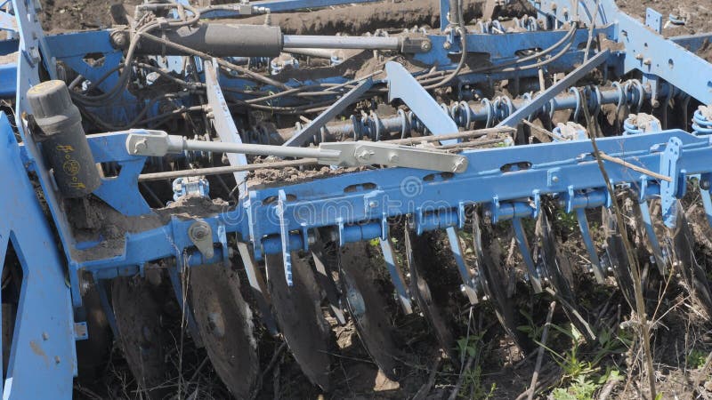 Disking the Soil. Short Disc Harrow. Work of Agricultural Machinery in ...