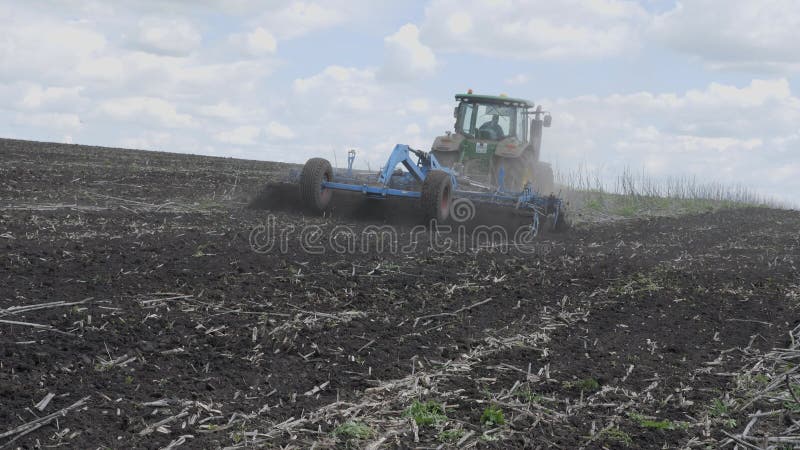Disking the Soil. Short Disc Harrow. Work of Agricultural Machinery in ...