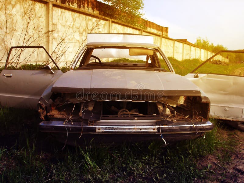 Dismantled an Old Rusty Car on the Outskirts of the Dump at Sunset ...
