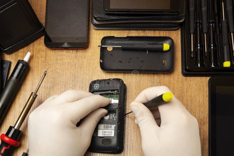 Dismantling an Old Phone for Repair on a Table Stock Image - Image of ...