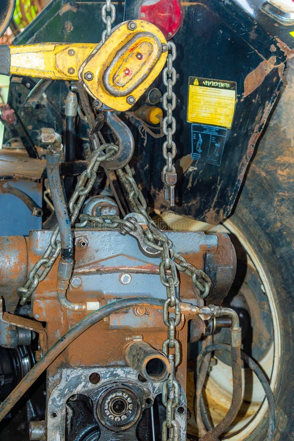 Dismantling a Tractor Engine with a Pulley and Chain Stock Photo ...