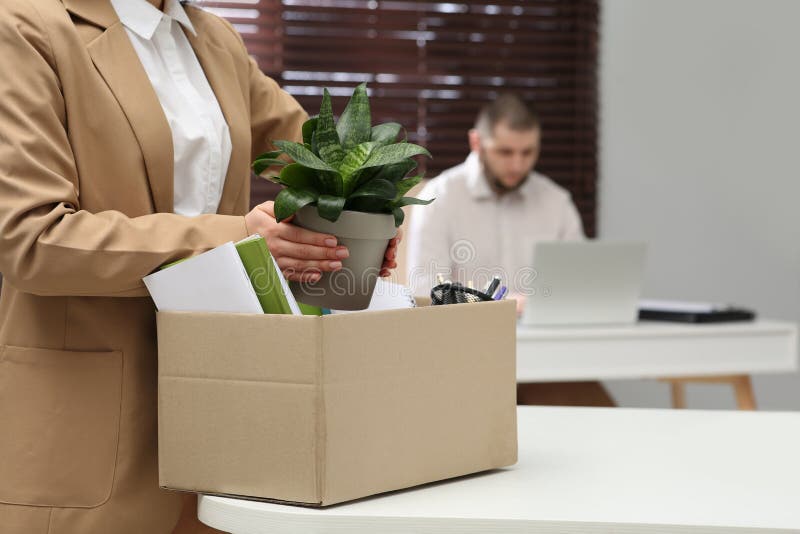Dismissed Woman Packing Personal Stuff into Box in Office, Closeup ...