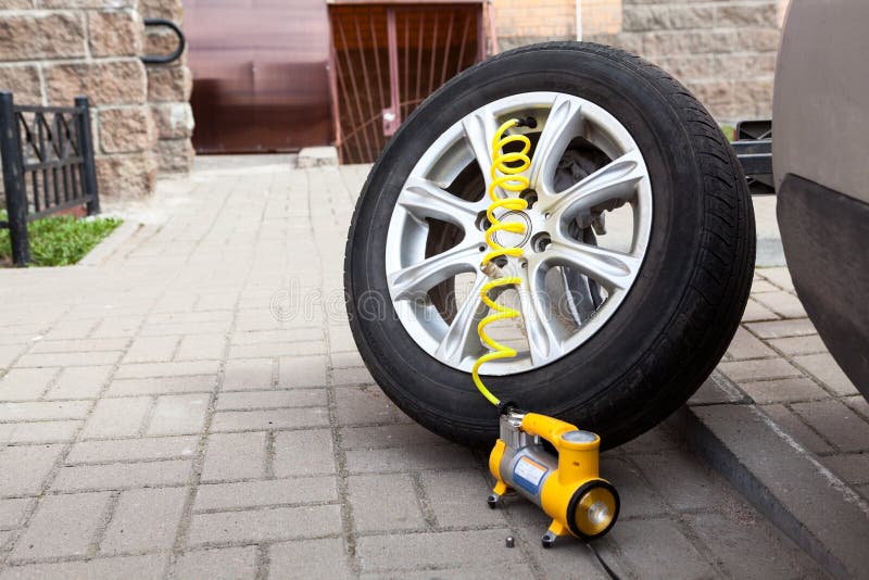 Dismounted Car Wheel Ready for Inflate a Tyre with Pneumatic Pump ...