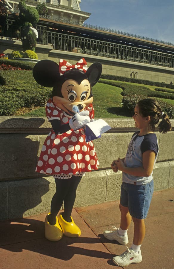 Disney World Magic Kingdom - Minnie Mouse and Fan Editorial Photo ...