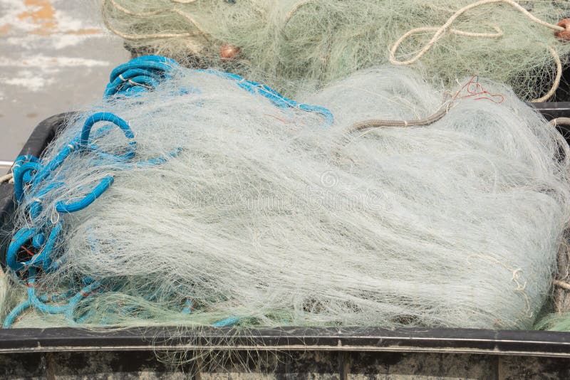 Disorderly Fine Mesh Fishing Nets in a Heap after Use Stock Photo ...