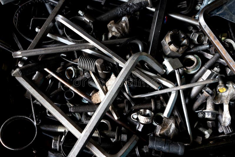 A Disorganized Assortment of Metal Tools and Hardware Components. Stock ...