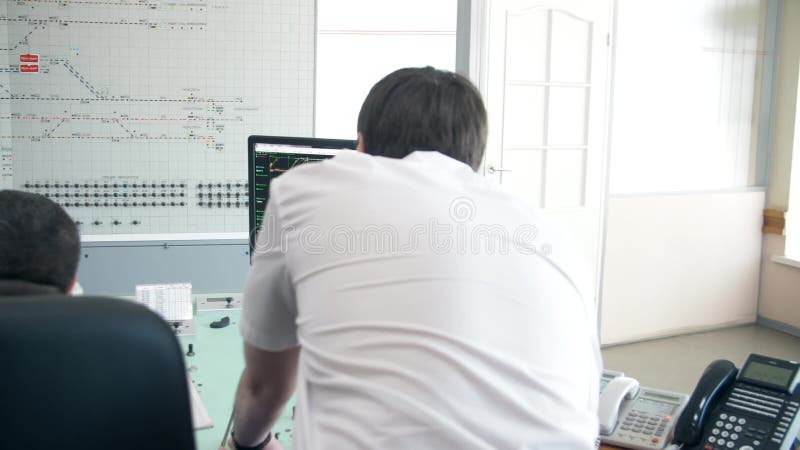 Dispatcher of the Railway at Work. Train Timetable Monitors, Train ...