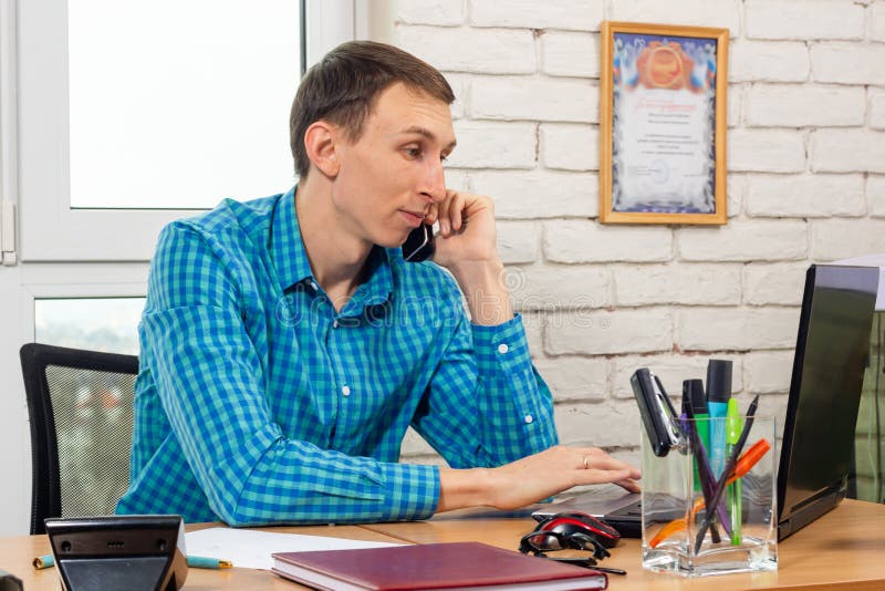 Dispatcher Working in a Laptop and Talking on the Phone Stock Image ...
