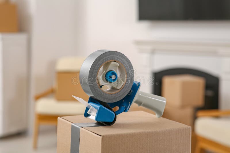Dispenser with Roll of Adhesive Tape on Box Indoors Stock Photo - Image ...