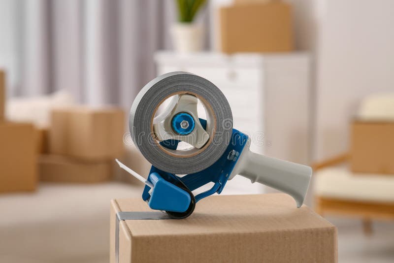 Dispenser with Roll of Adhesive Tape on Box Indoors Stock Photo - Image ...