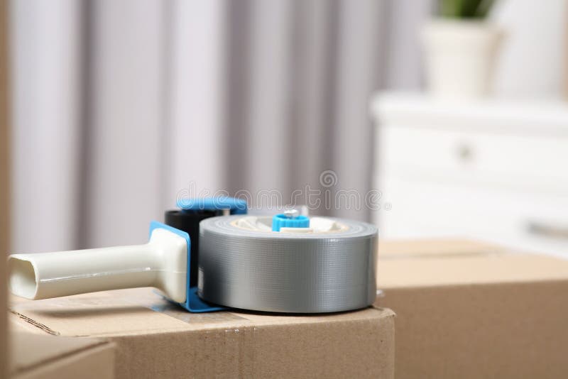 Dispenser with Roll of Adhesive Tape on Box Indoors, Closeup Stock ...