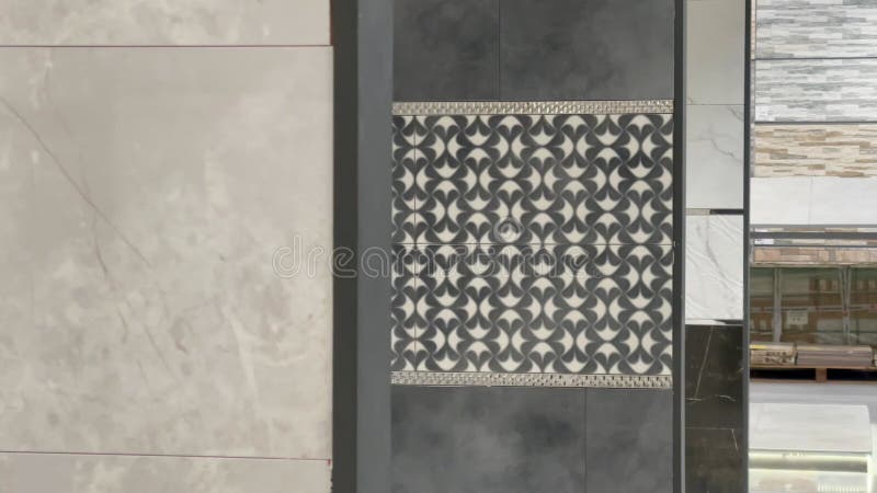 A Display of Decorative Wall Tiles Combines Neutral Stone with a Bold ...