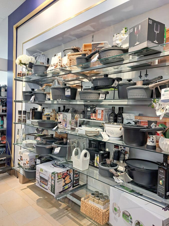 Display in a Large Supermarket with Kitchen Goods. Pans and Pots on the ...