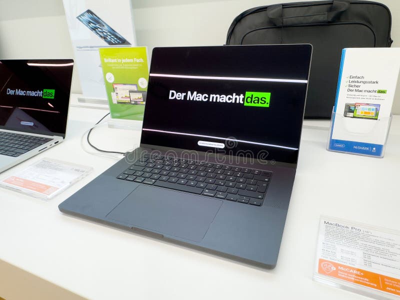 Display of Macbook Pro Laptop in Electronics Store with Marketing ...