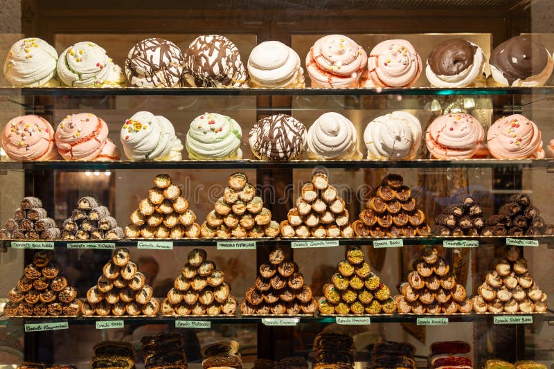 A Display of Many Different Types of Pastries, Including Cupcakes and ...
