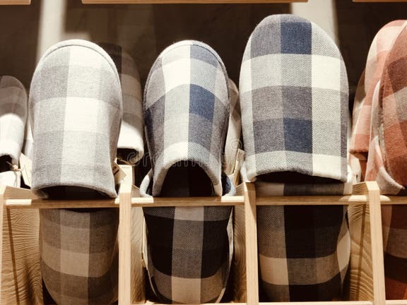 A Display of Plaid Slippers in Different Colors and Patterns, Including ...