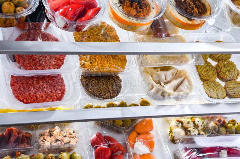 A Display of Prepackaged Food Products in Plastic Boxes Stock Photo ...