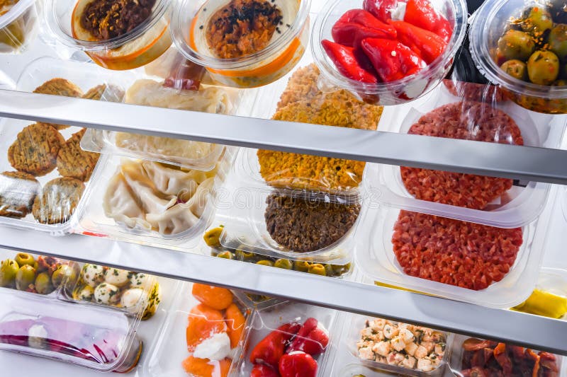 A Display of Prepackaged Food Products in Plastic Boxes Stock Photo ...