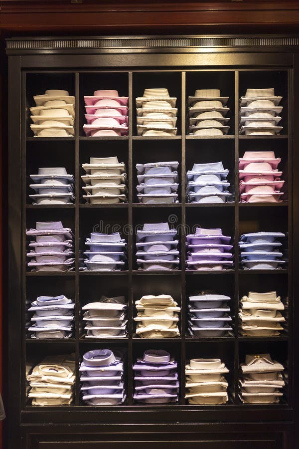 .a Display Rack Made of Red Wood Featuring Men S Shirts Organized Stock ...