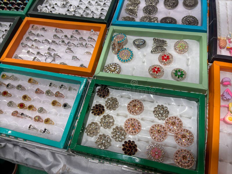 A Display of Rings and Other Jewelry in a Store Stock Image - Image of ...