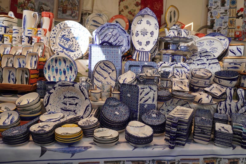 Display of Various Ceramic Dishes with Fish Patterns on a Table Market ...