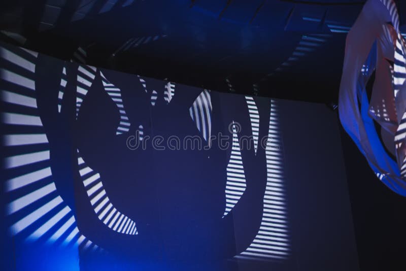 Displays a Shadow that is Illuminated on the White Wall. Object is ...