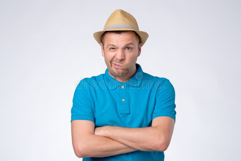 Displeased Young Man in Apron Sniffing His Hands. Stock Image - Image ... Displeased Young Man in Apron Sniffing His Hands. Stock Image - Image ...