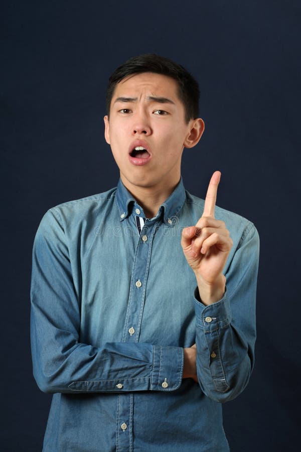 Displeased Young Asian Man Gesturing with One Hand Stock Image - Image ...