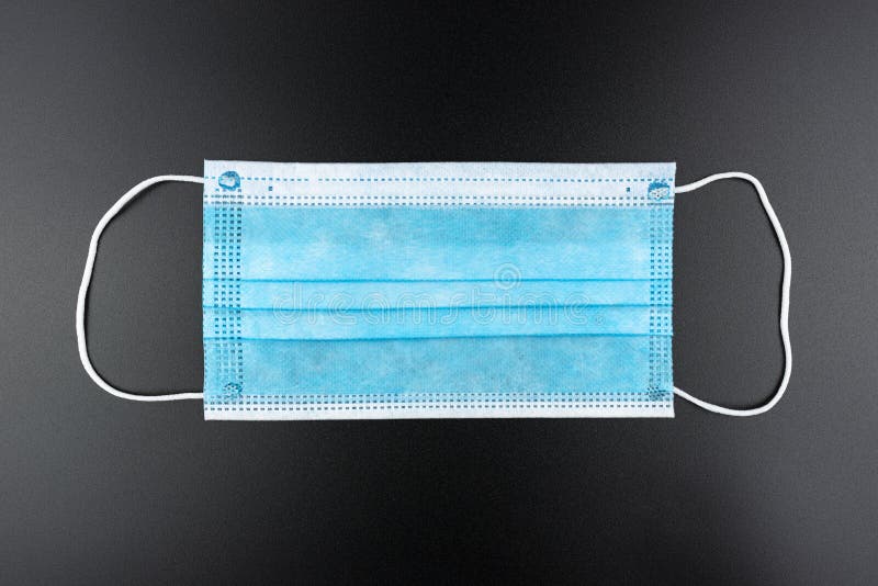 Disposable Blue Surgical Mask, Isolated on a Black Background, Top View ...